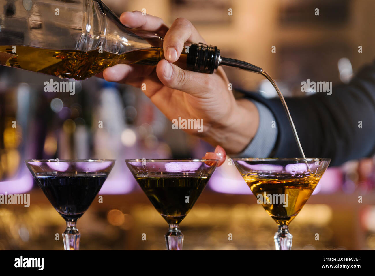 Expert barman is making cocktail at night club Stock Photo - Alamy