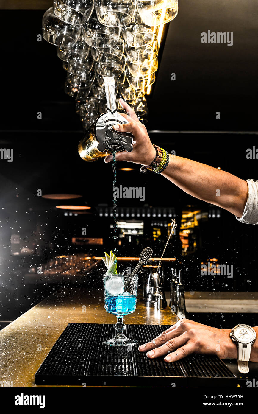 Expert barman is making cocktail at night club Stock Photo - Alamy