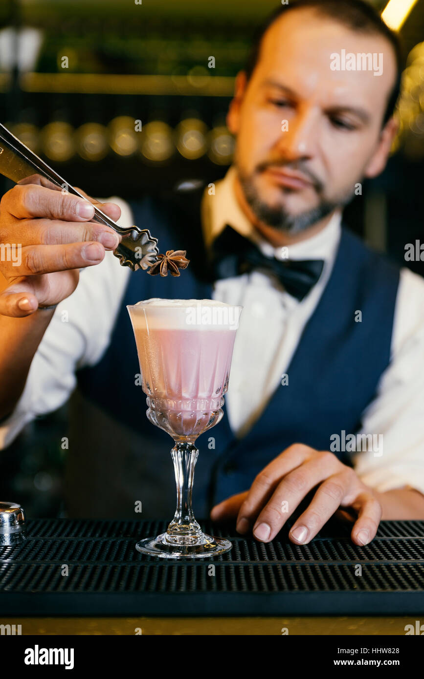 Bartender making cocktails yellow shaker hi-res stock photography and ...