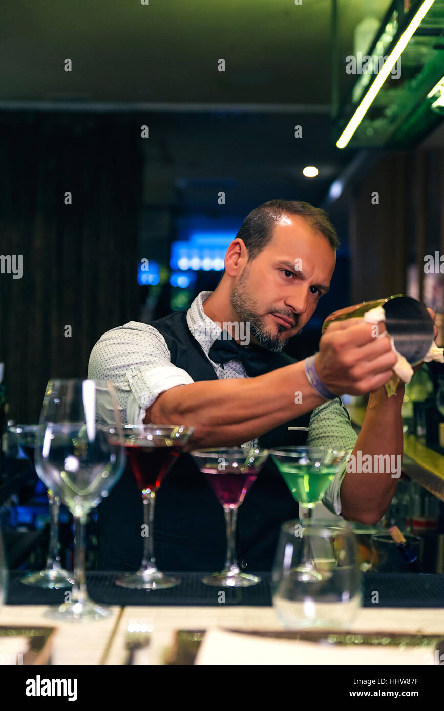 Expert barman is making cocktail at night club Stock Photo - Alamy