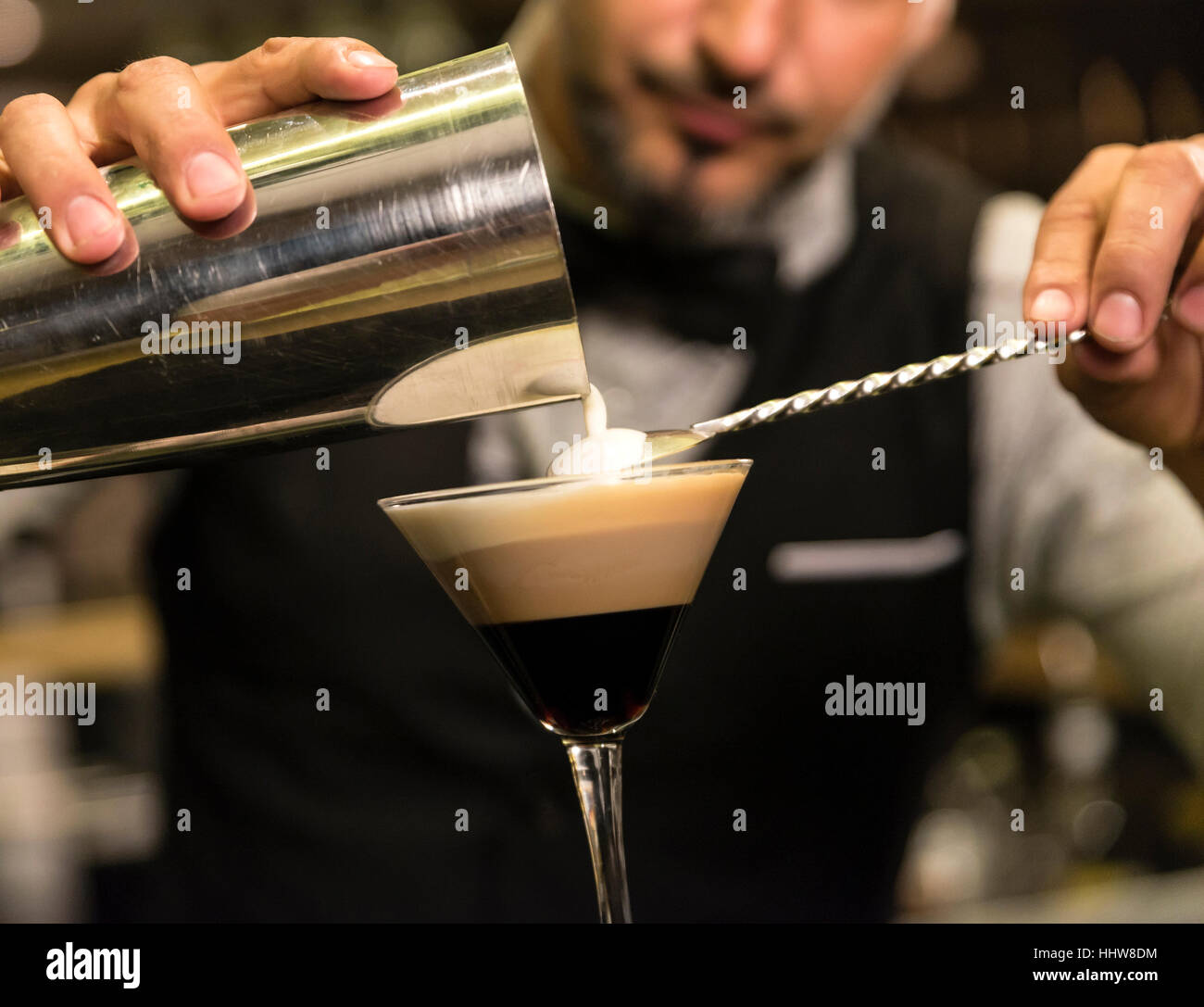 Barman is making cocktail at night club Stock Photo - Alamy