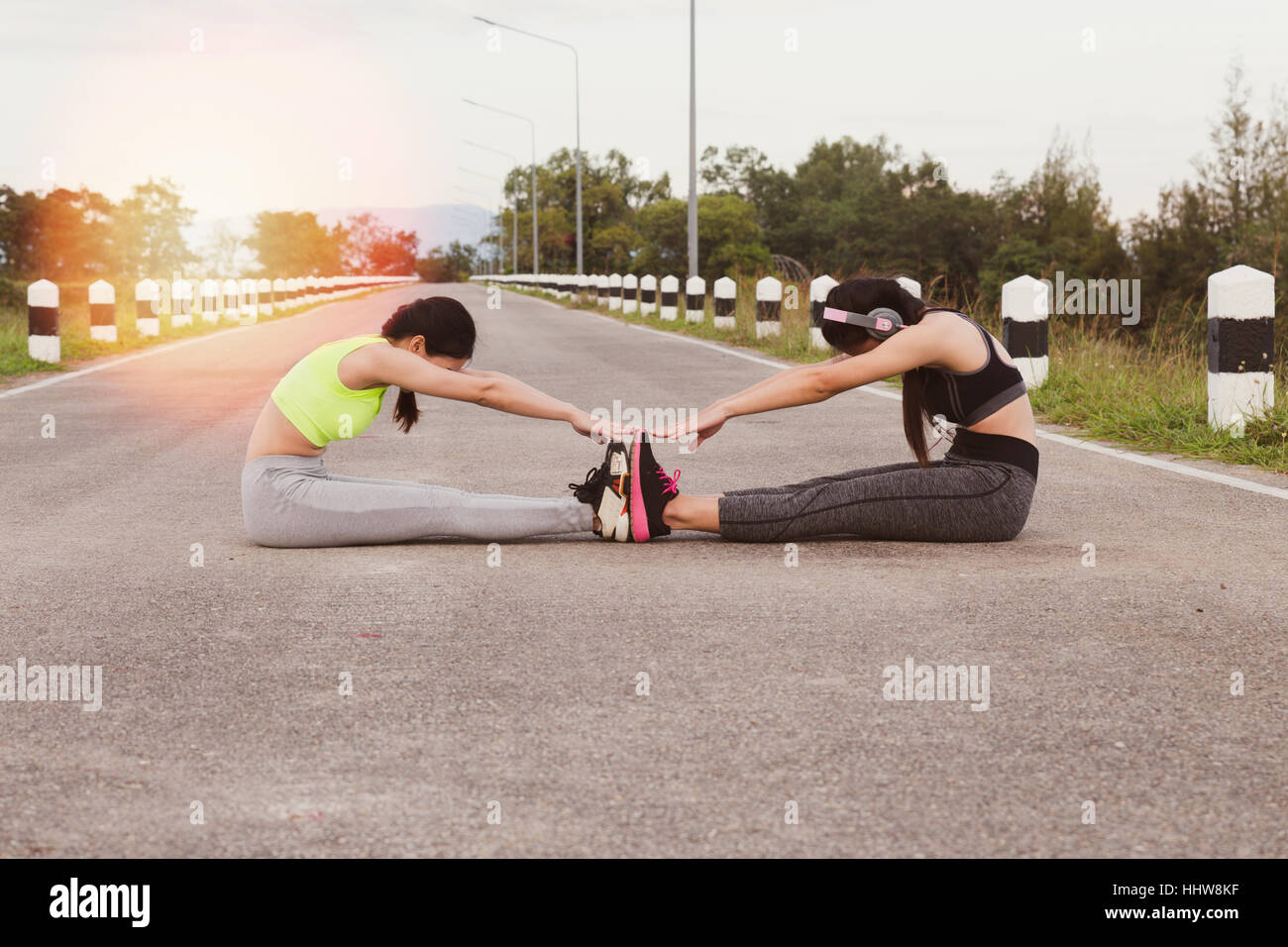 young athlete girl exercises workout outdoor in park. calmness and ...