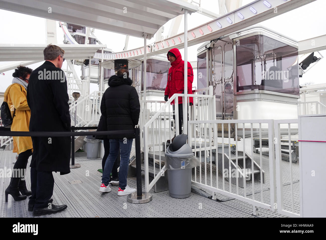 Ferris wheel employee of La Grande Roue (Ferris Wheel), people waiting ...
