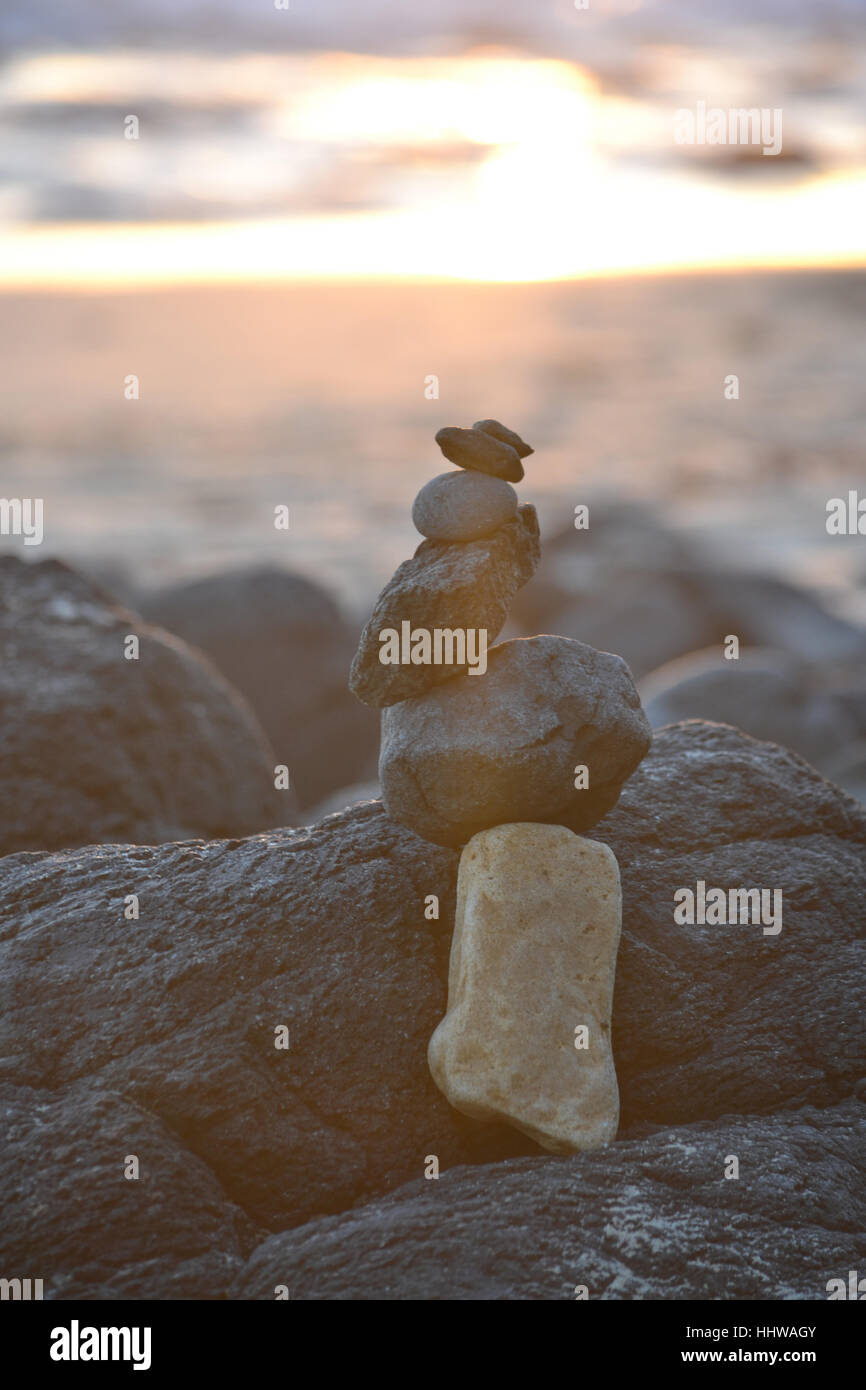 Rock stack at sunset Stock Photo - Alamy