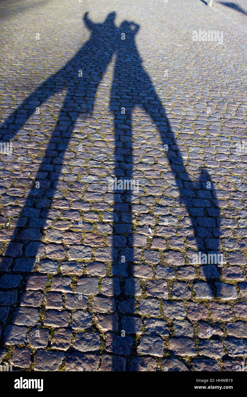 Shadows of 2 people travelling Stock Photo - Alamy