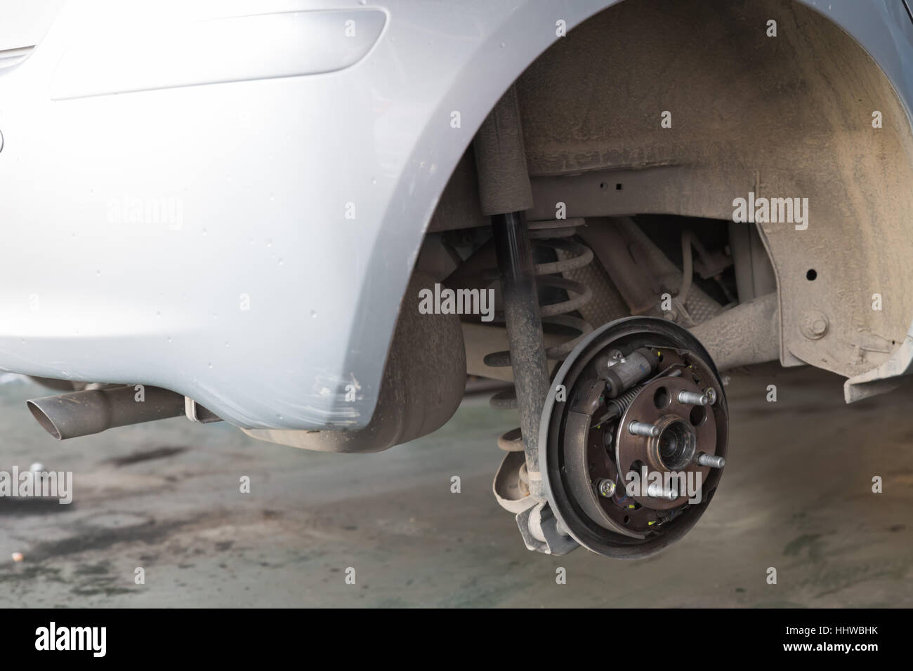 mechanic changing a wheel of a modern car, tire replacement service ...