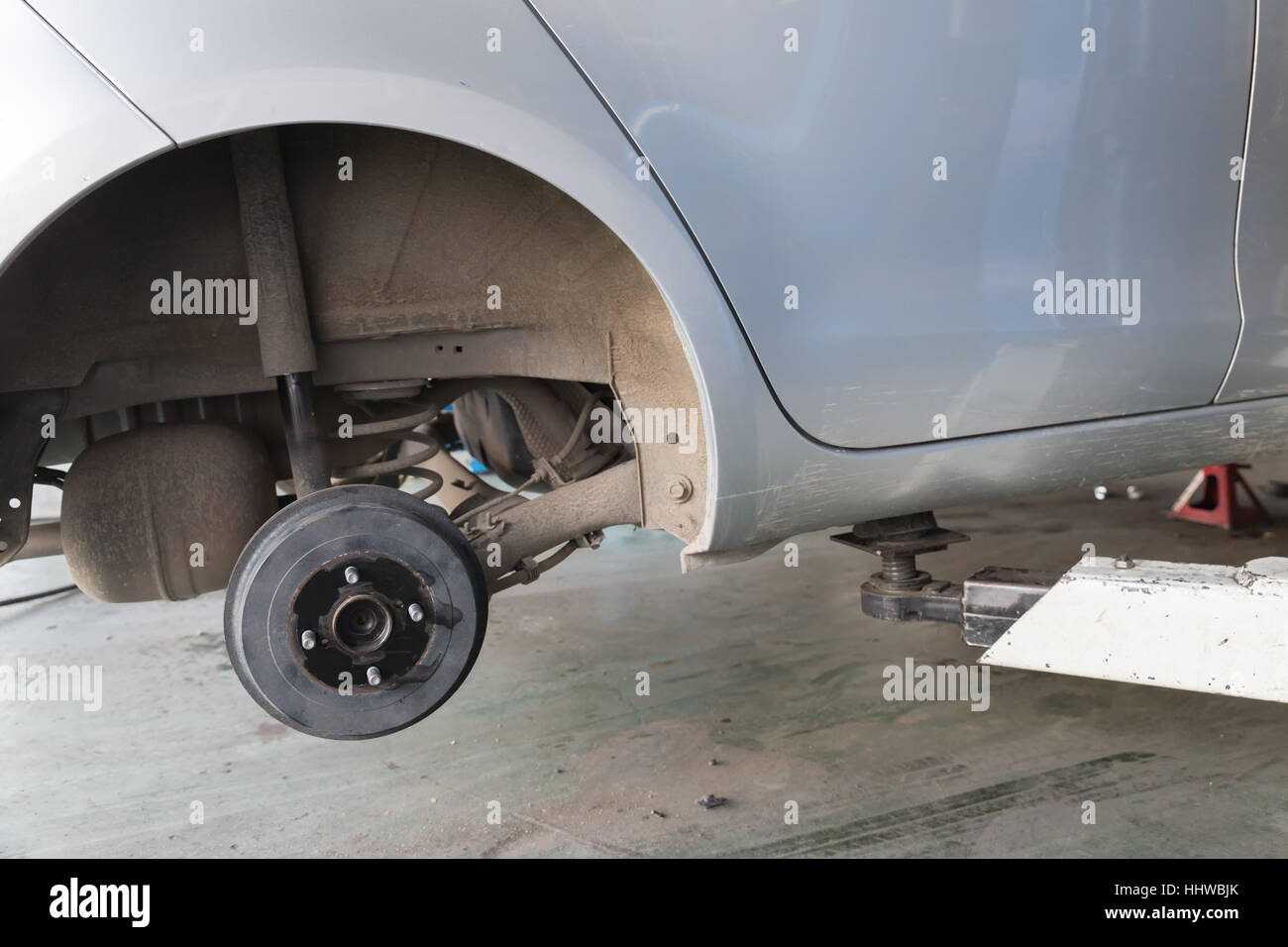 mechanic changing a wheel of a modern car, tire replacement service ...