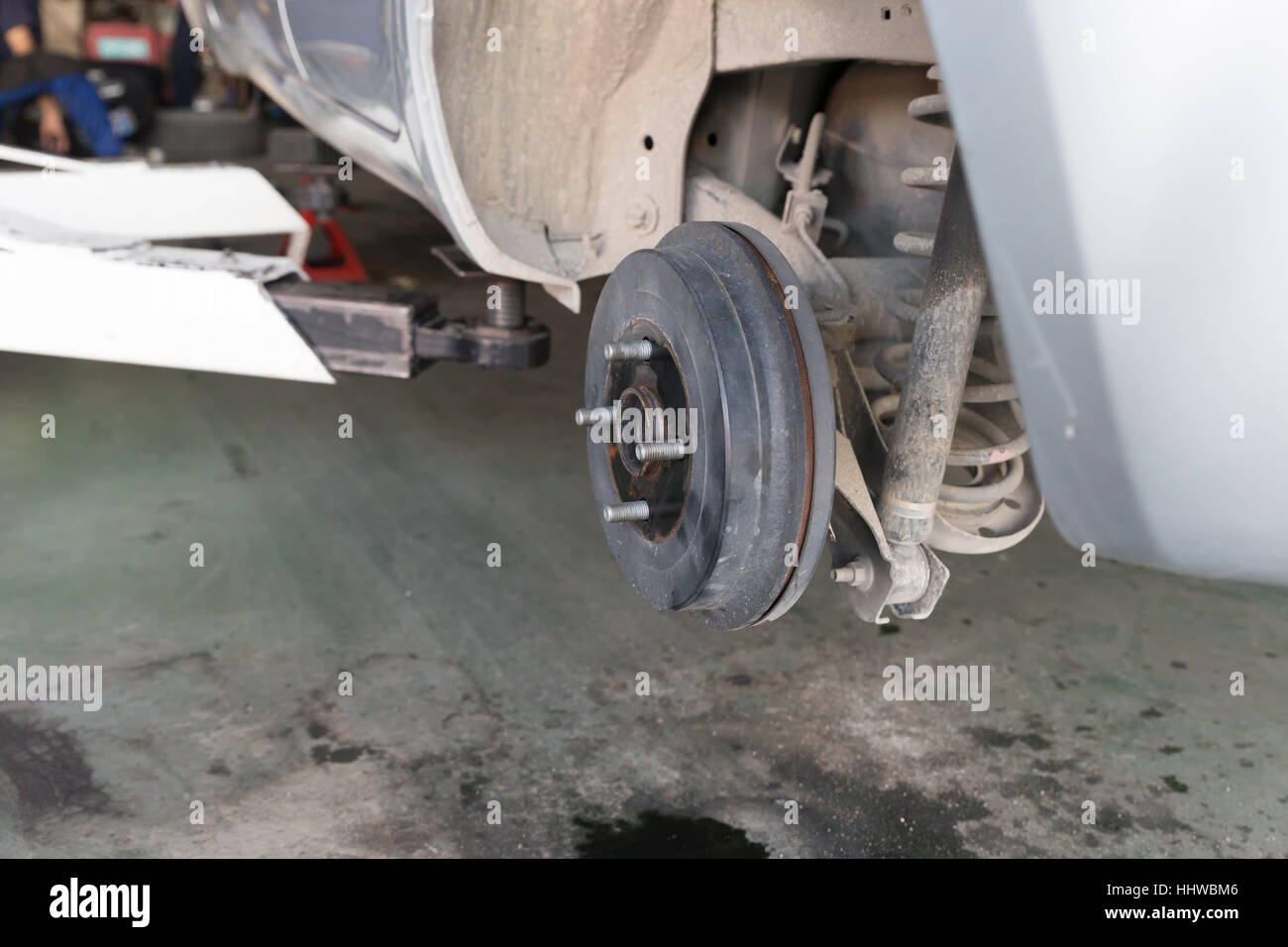 mechanic changing a wheel of a modern car, tire replacement service ...