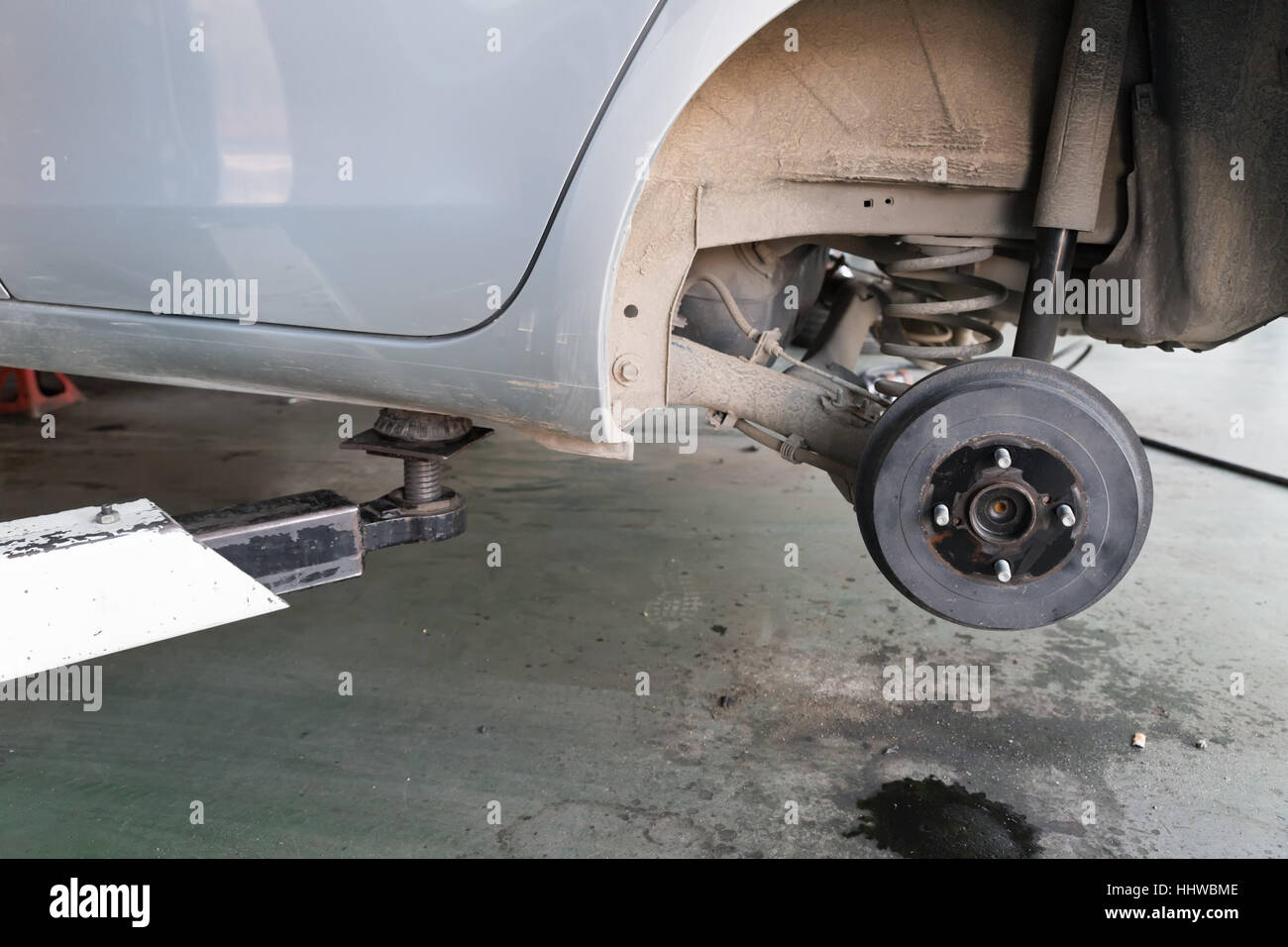 mechanic changing a wheel of a modern car, tire replacement service ...