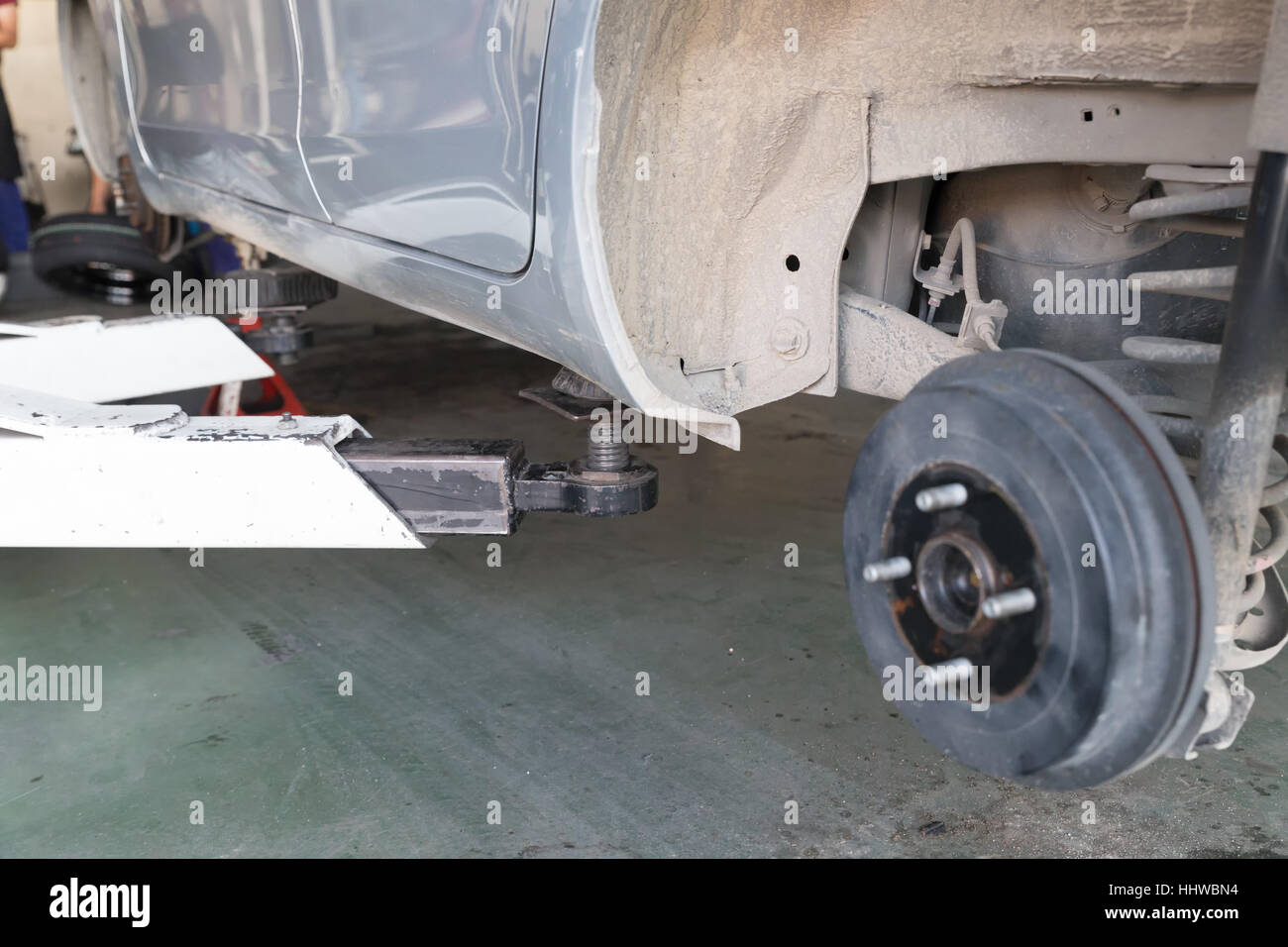 mechanic changing a wheel of a modern car, tire replacement service ...