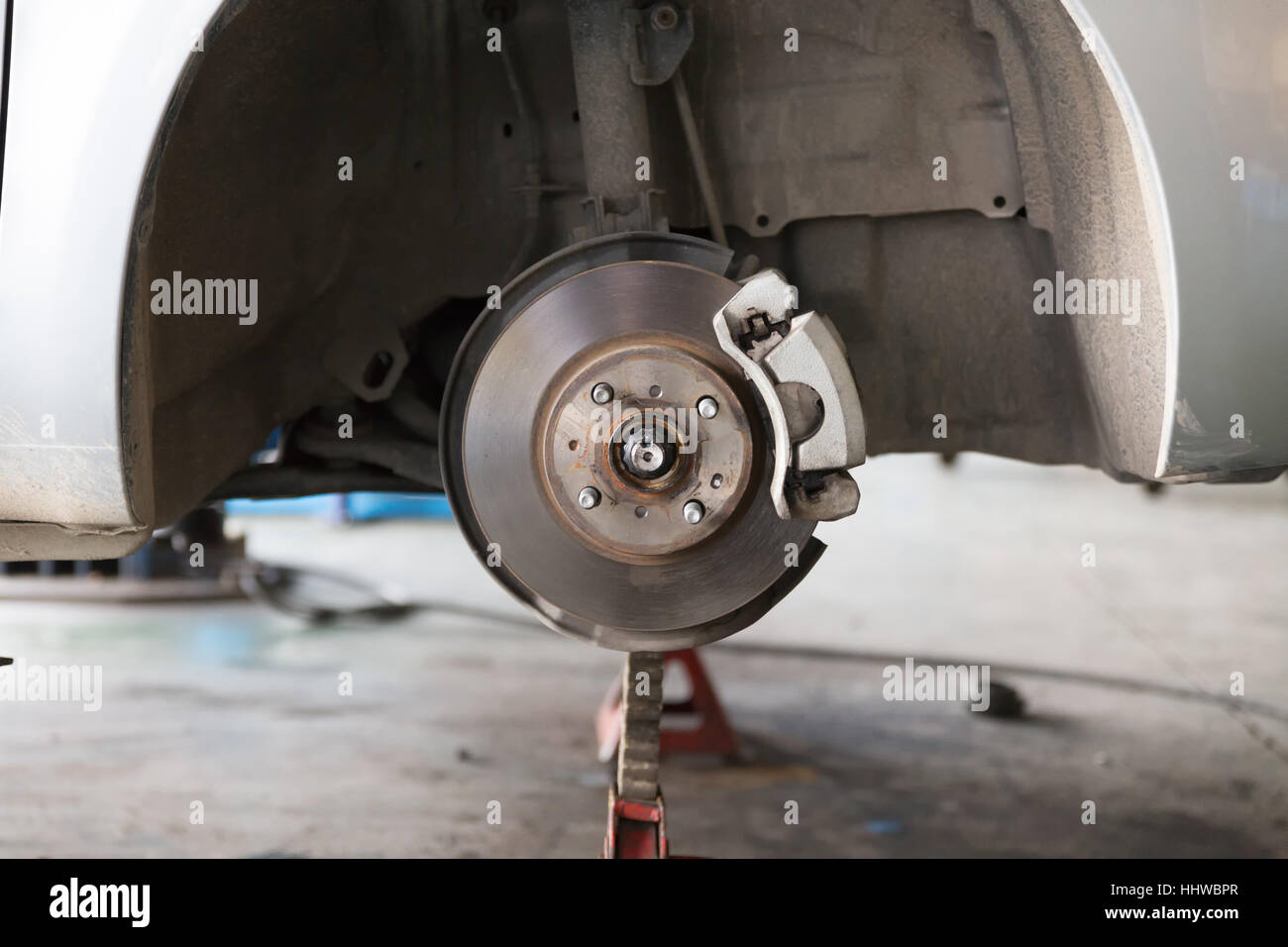 mechanic changing a wheel of a modern car, tire replacement service ...