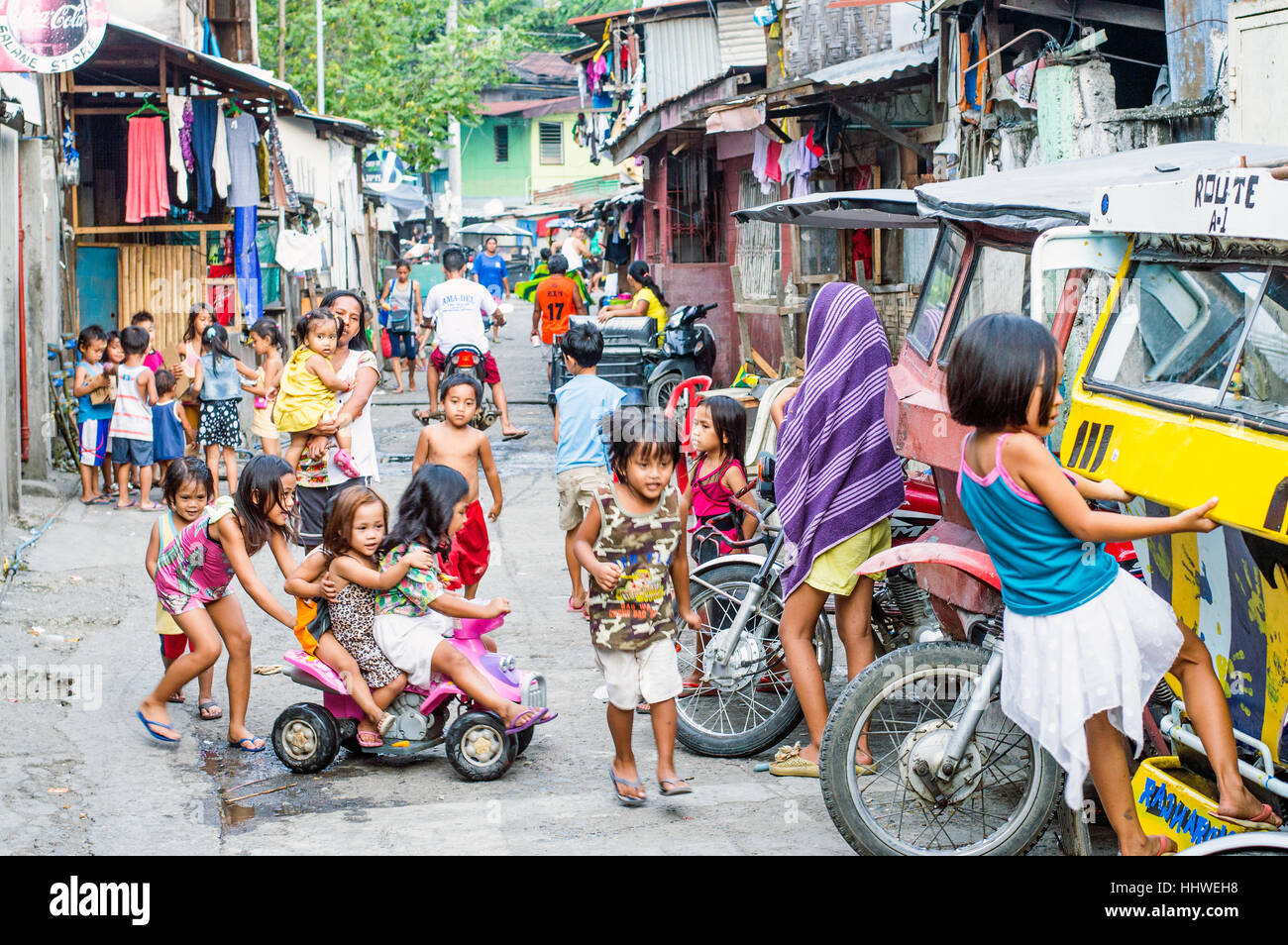 Children in slum by Bangkerohan River, Davao, Davao Del Sur ...