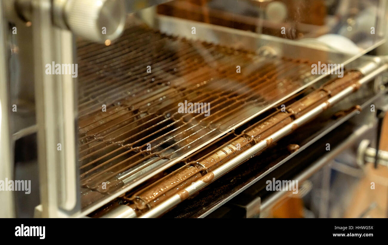 Product conveyor line on a chocolate factory Stock Photo - Alamy