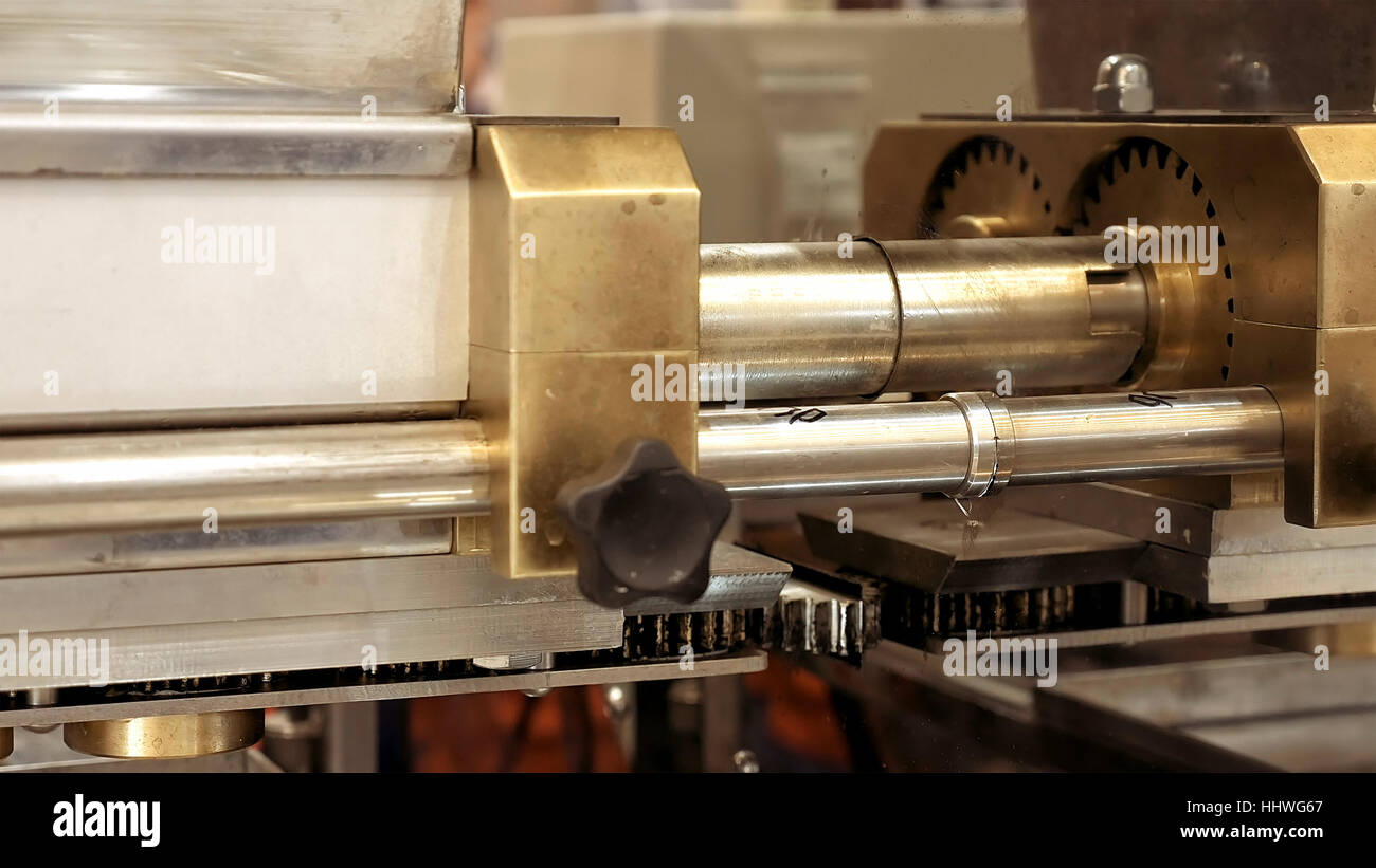 Mechanical gear equipment rotating cogwheel Stock Photo - Alamy