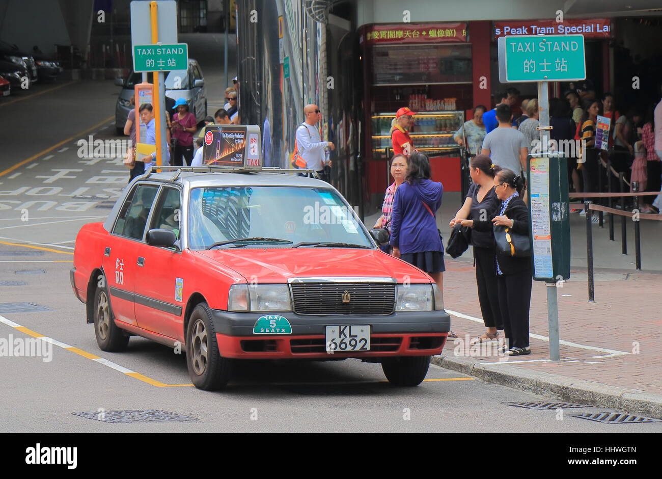People take a taxi in Hong Kong Stock Photo - Alamy