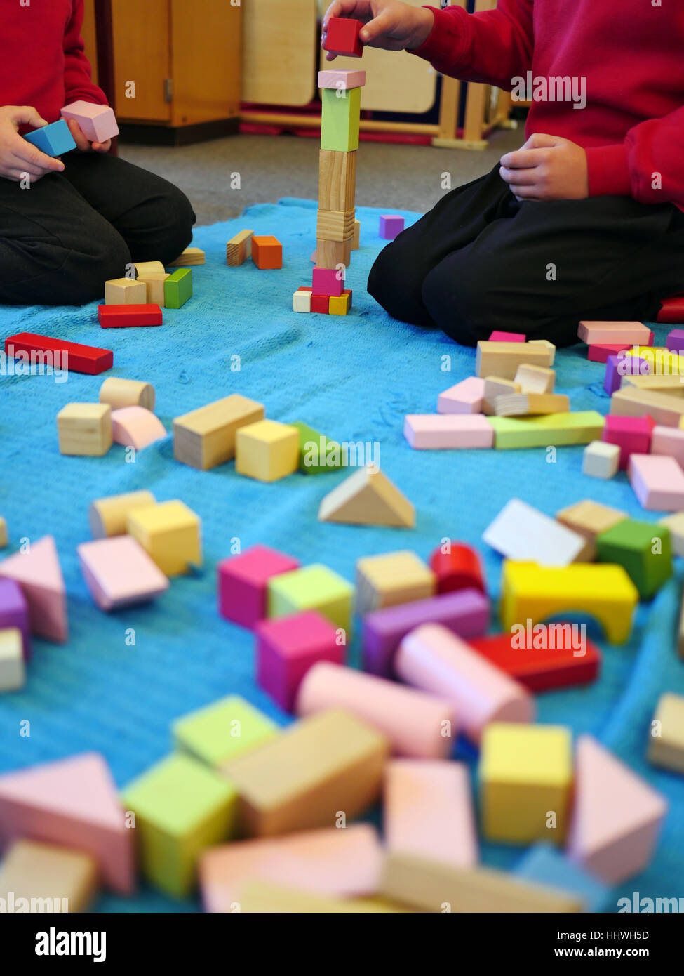 Primary school children playing with building blocks Stock Photo - Alamy