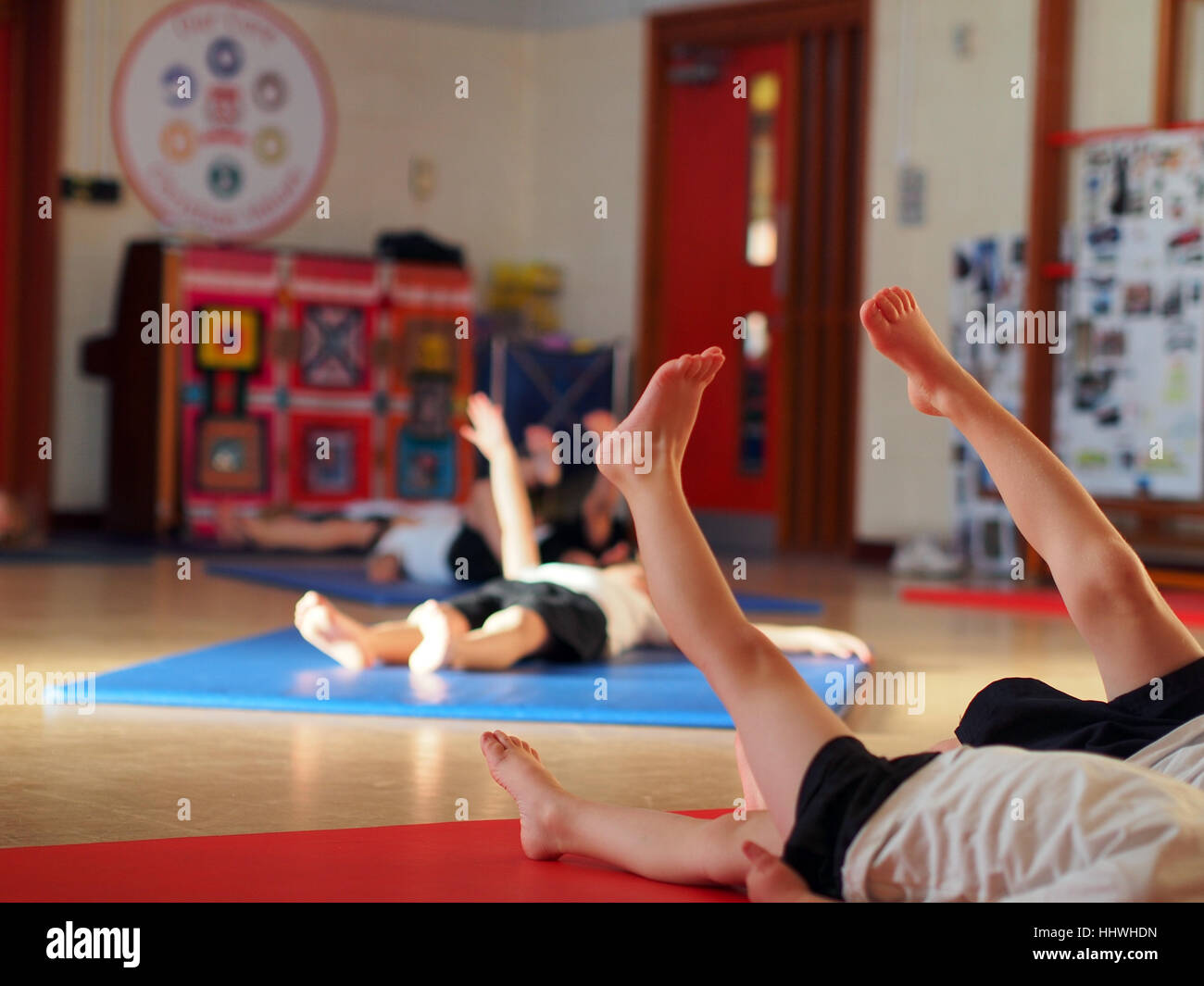 primary school children in the gym doing exercise Stock Photo - Alamy