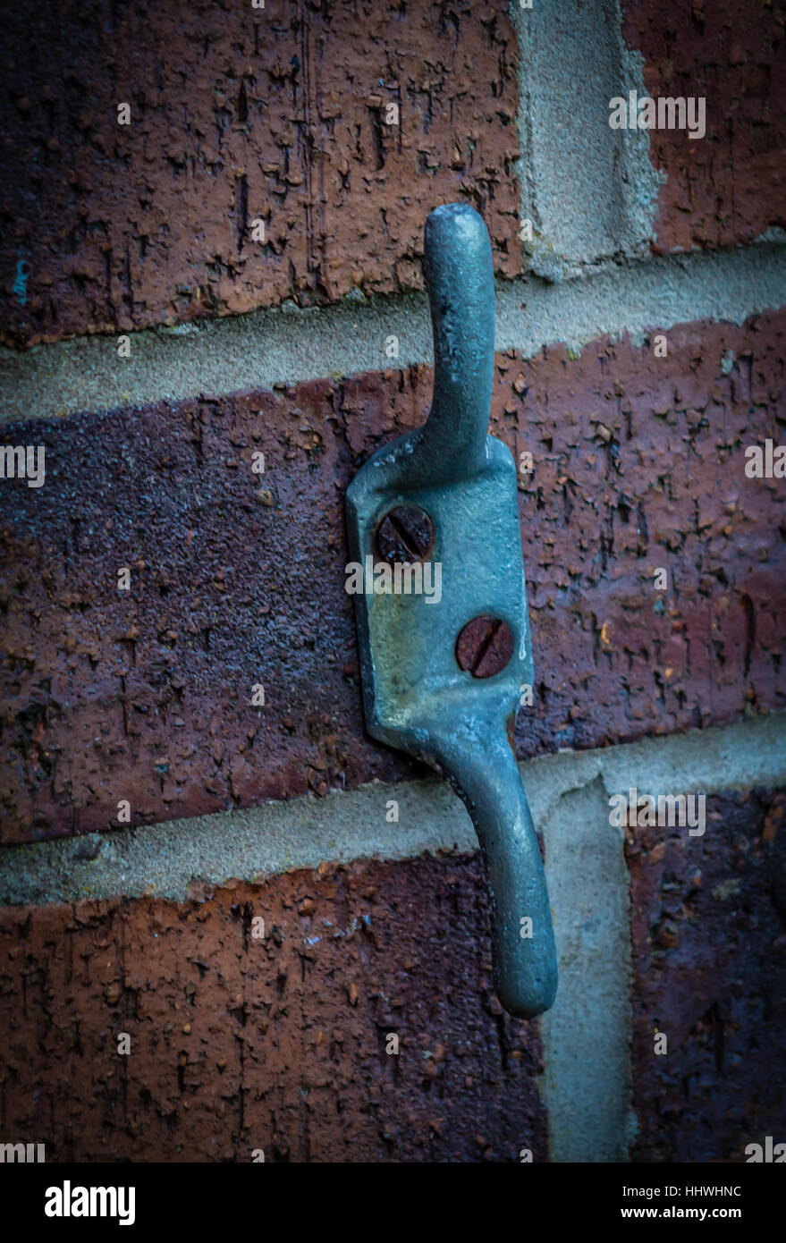 A rust old metal rope hook with screws Stock Photo - Alamy