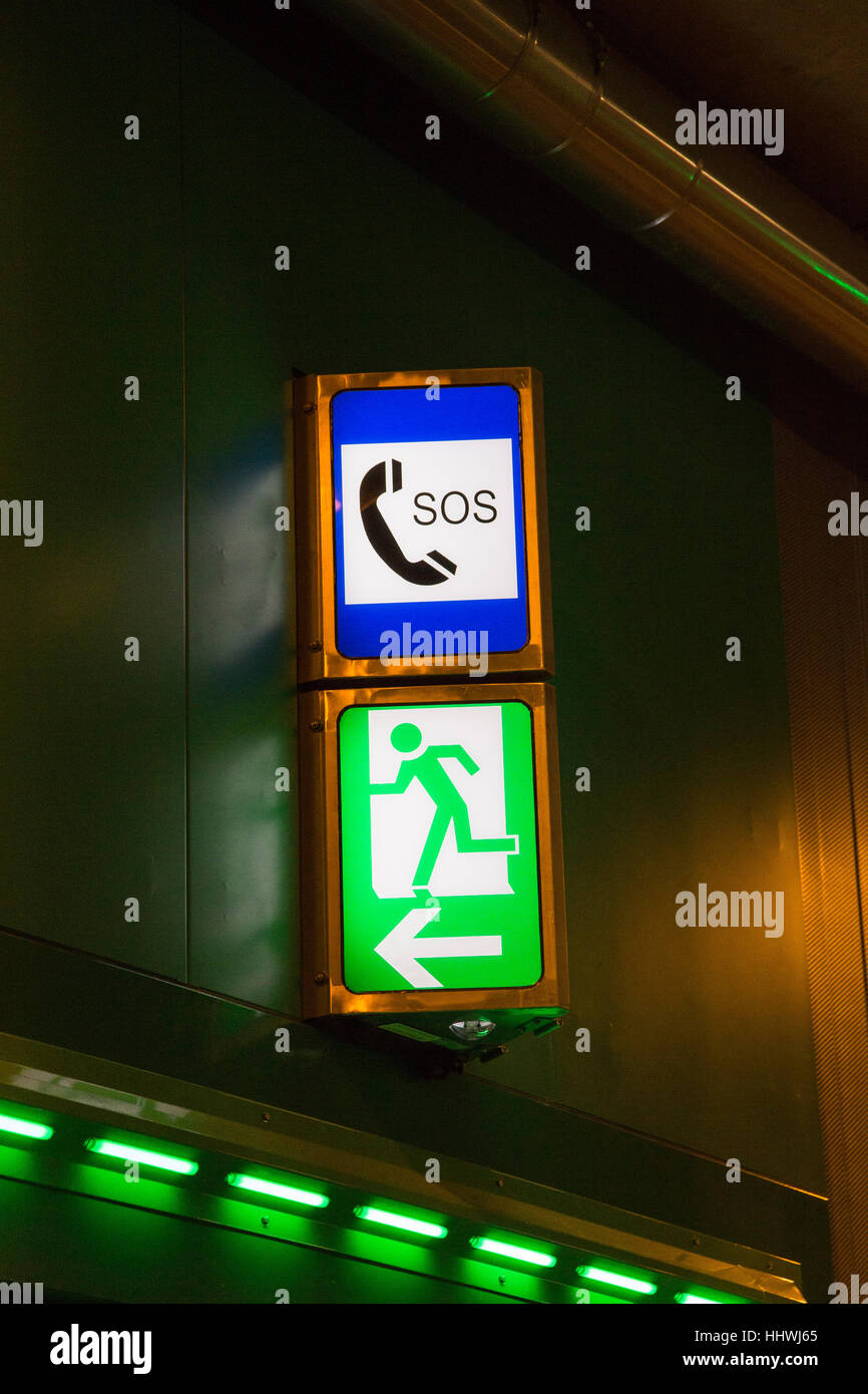Illuminated emergency exit and SOS signs in a road tunnel, Luise ...