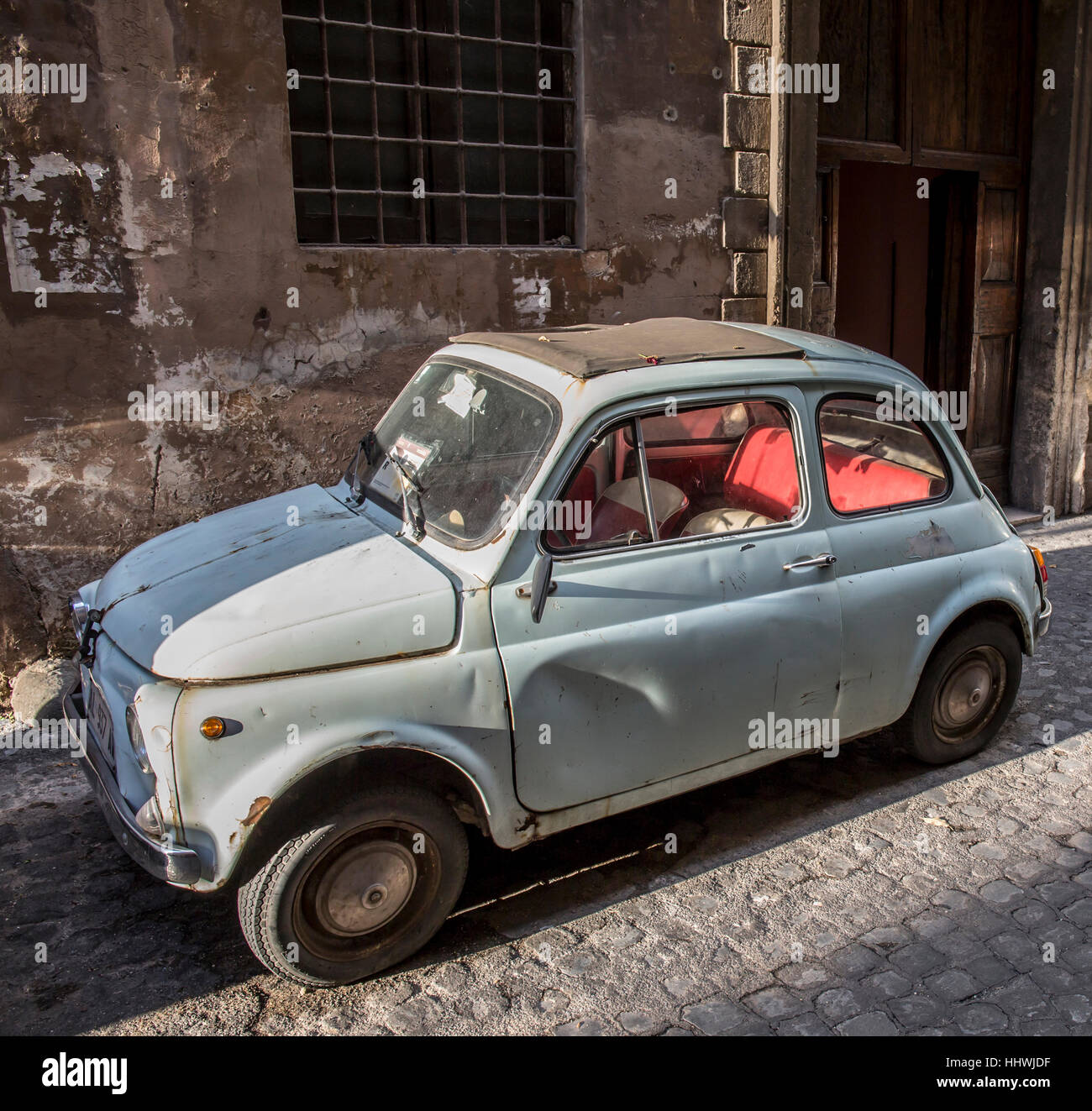 A battered old Fiat 500 parked in Rome, Italy, Europe Stock Photo - Alamy