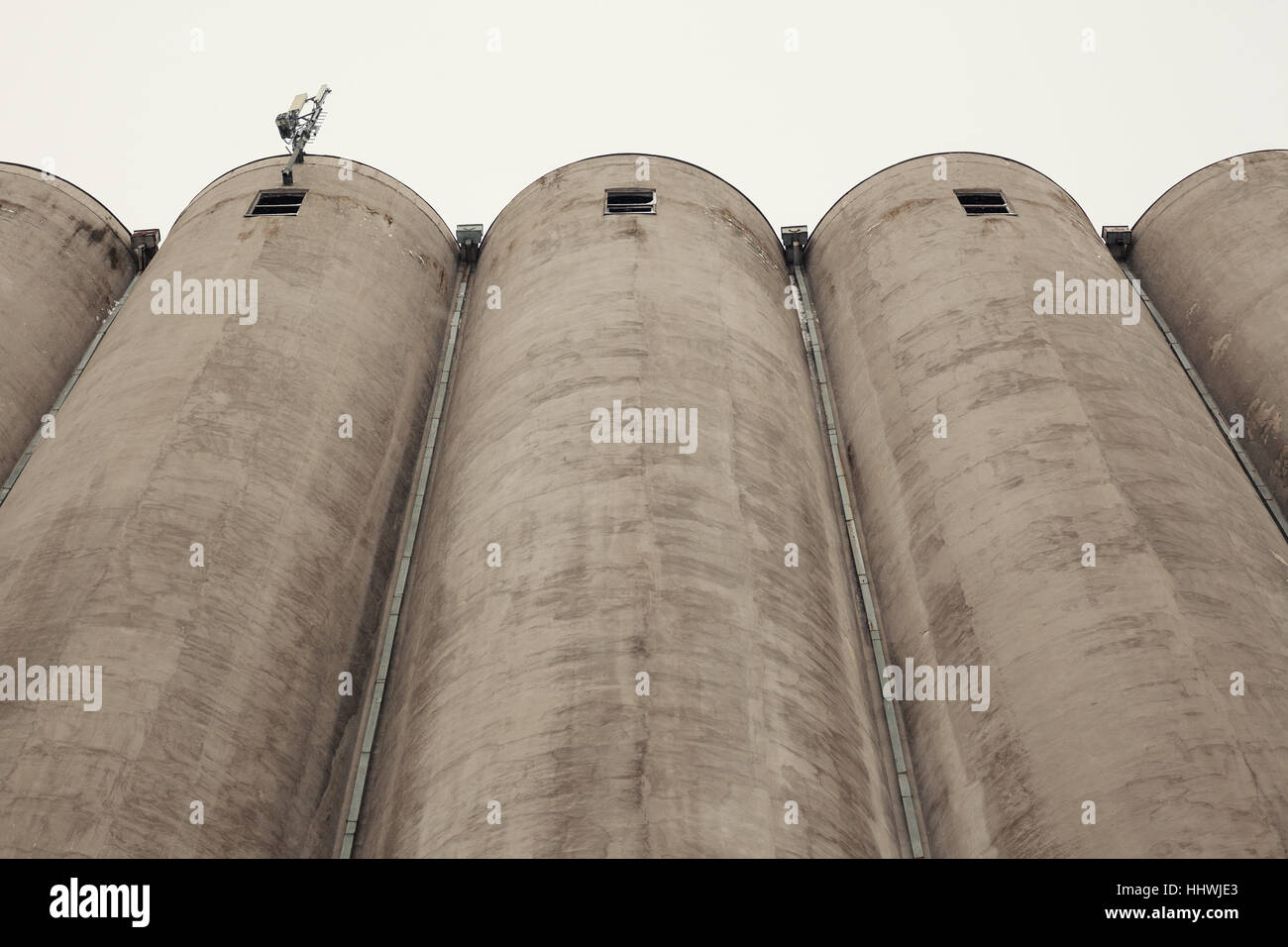 Abstract composition of grain tanks, high and gray buildings details ...