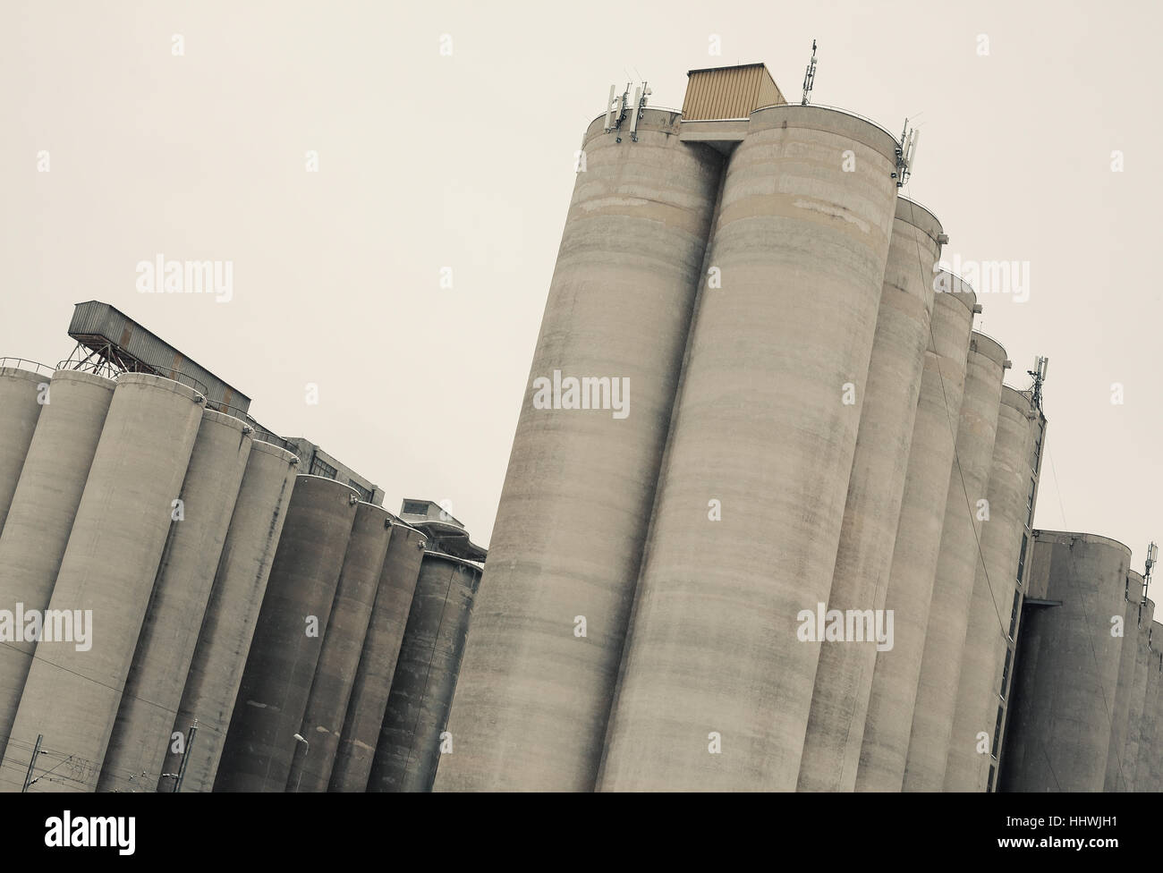 Abstract composition of grain tanks, high and gray buildings details ...