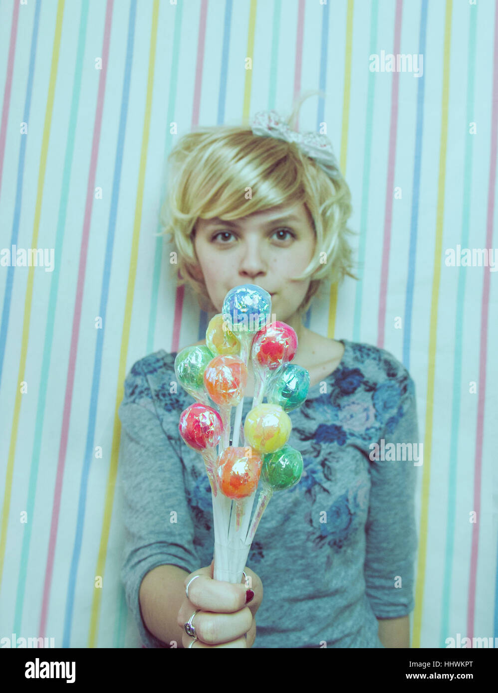 Young blond woman with a sweet look Stock Photo - Alamy