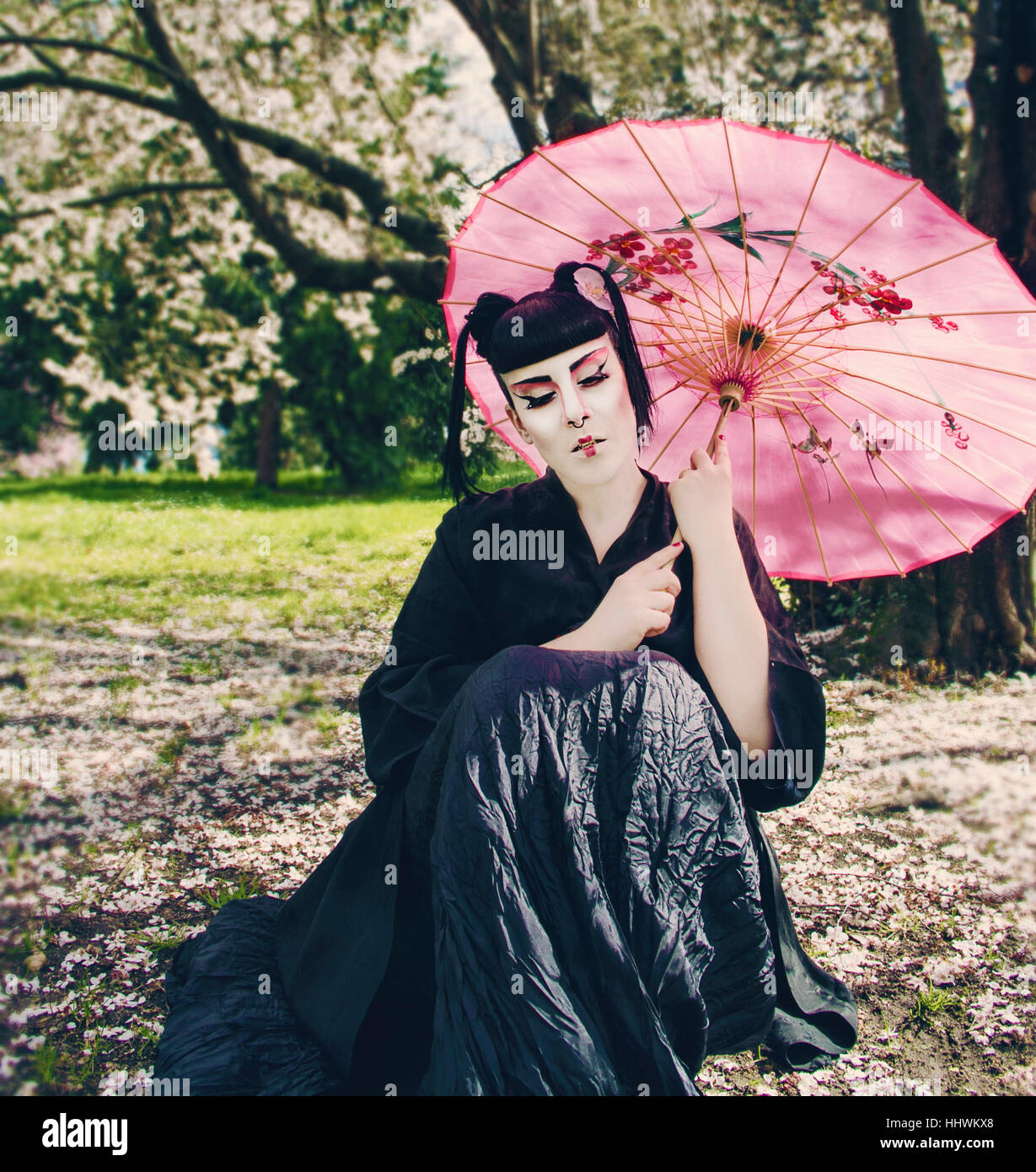 Portrait of a geisha in spring in a park full of almond trees Stock ...