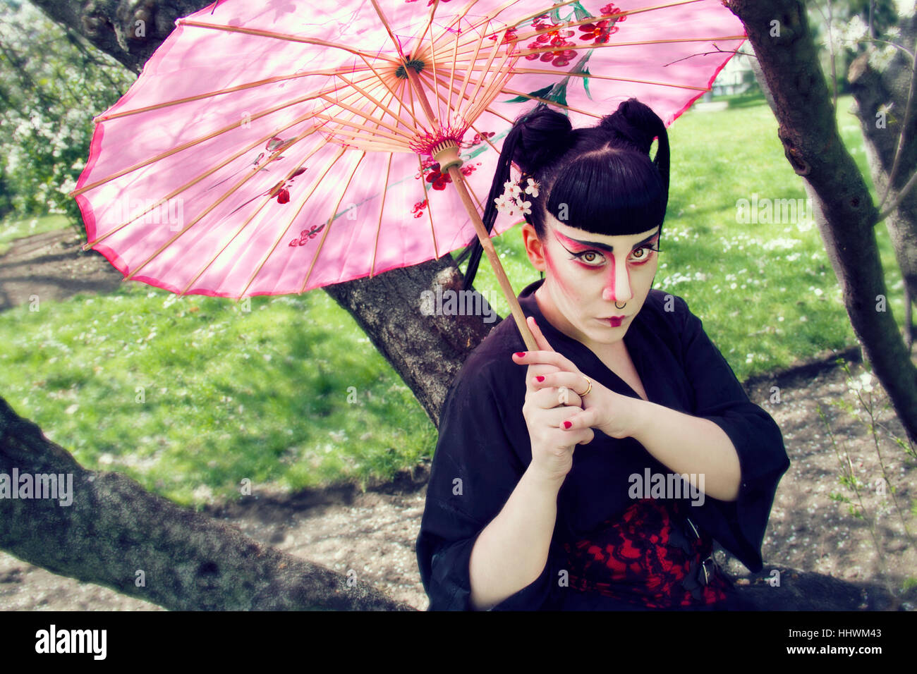 Portrait of a geisha in spring in a park full of almond trees Stock ...