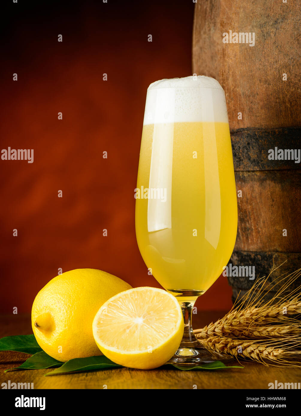 Beer with sliced lemon on wood table and wooden barrel Stock Photo - Alamy