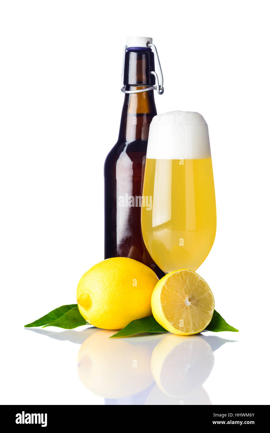Shandy beer with fresh yellow lemon isolated on white background Stock ...