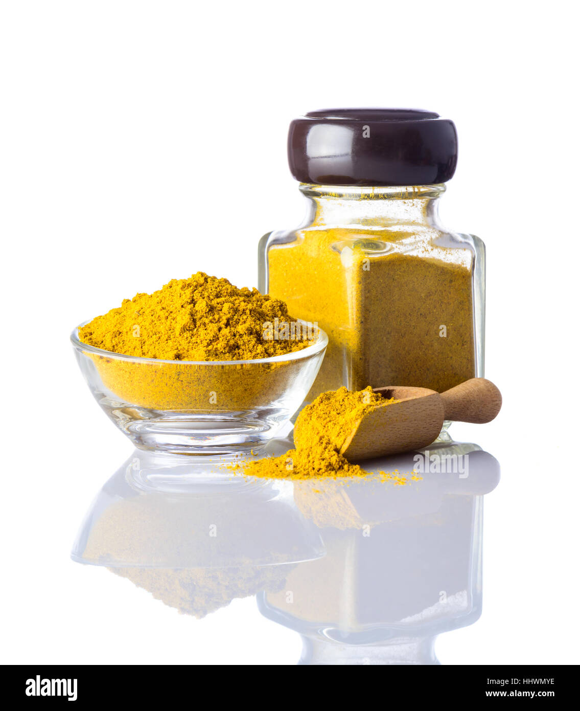 Yellow curry powder in glass jar isolated on white background Stock ...