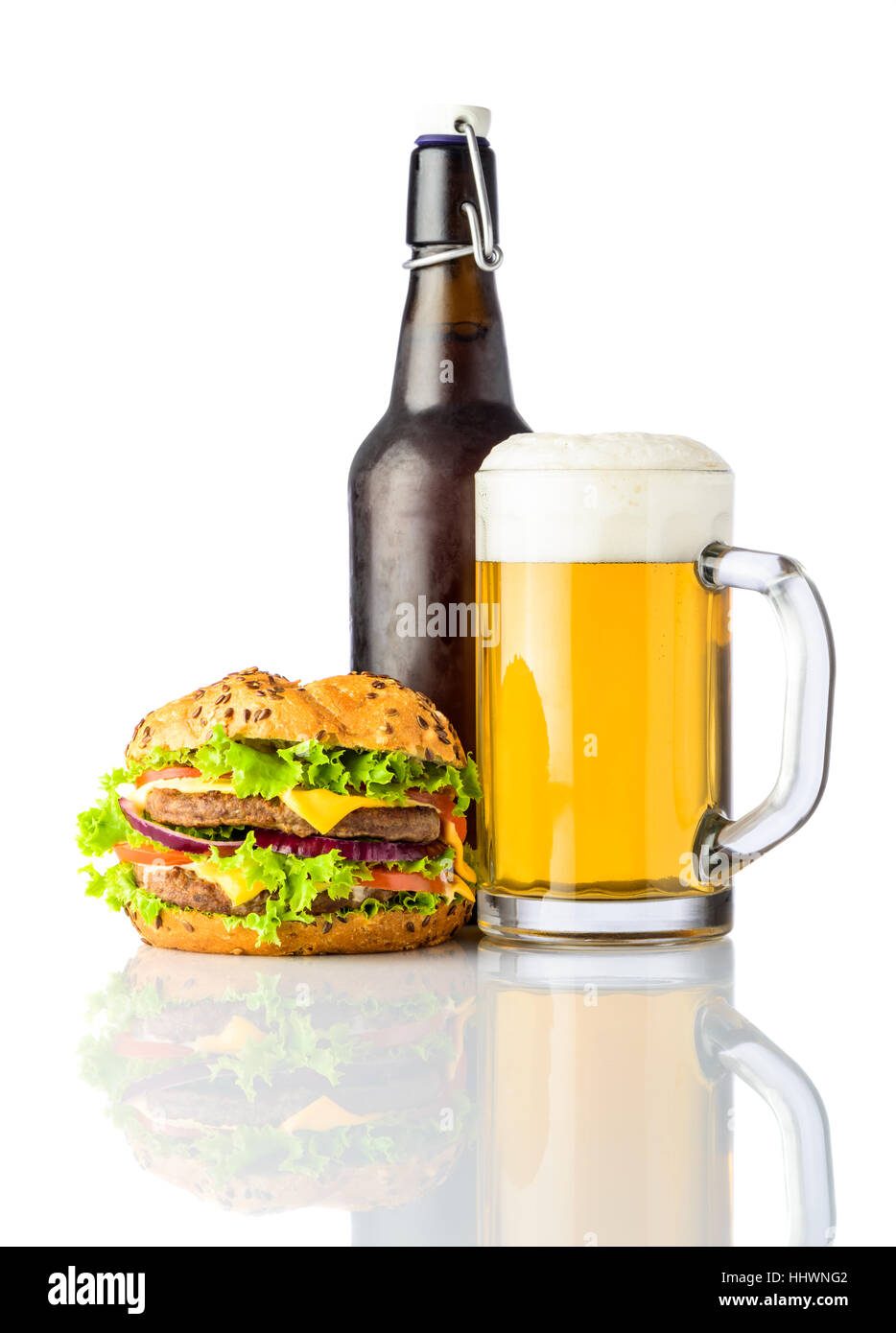 Bottle and Mug of Cold Beer with Fast food Burger on white background ...