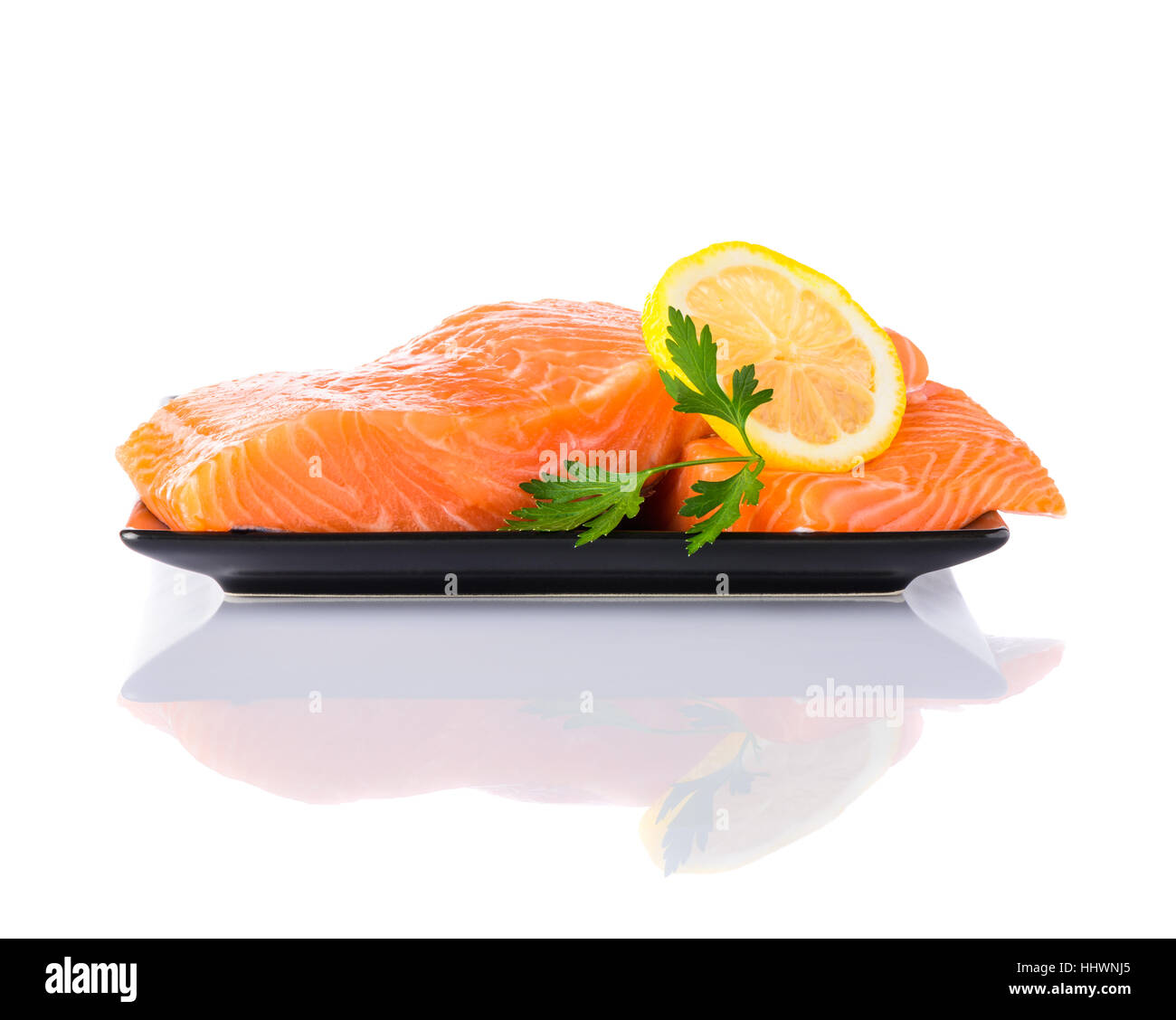 Red Fish Meat Fillet on Dark Plate and Isolated On White Background ...