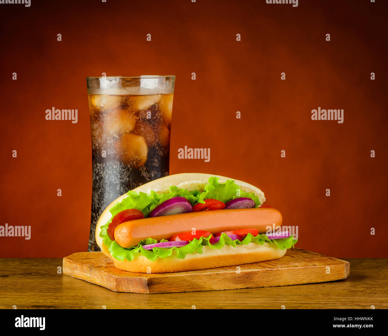 Hot Dog Sandwich with Glass of Cold Cola with Ice Stock Photo - Alamy
