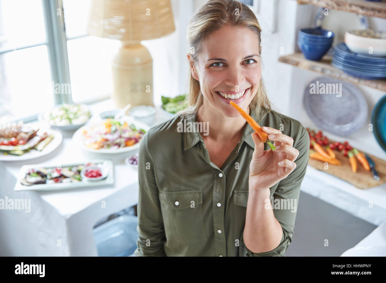Woman eating carrot hi-res stock photography and images - Alamy