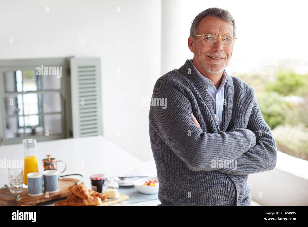 Portrait smiling senior man at breakfast on patio table Stock Photo - Alamy