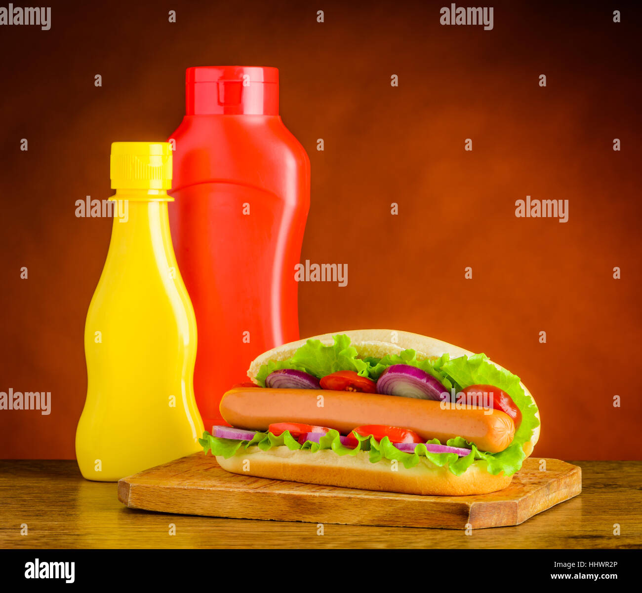 Hot dog Sandwich with Sausage in a sliced bun and Ketchup with mustard ...