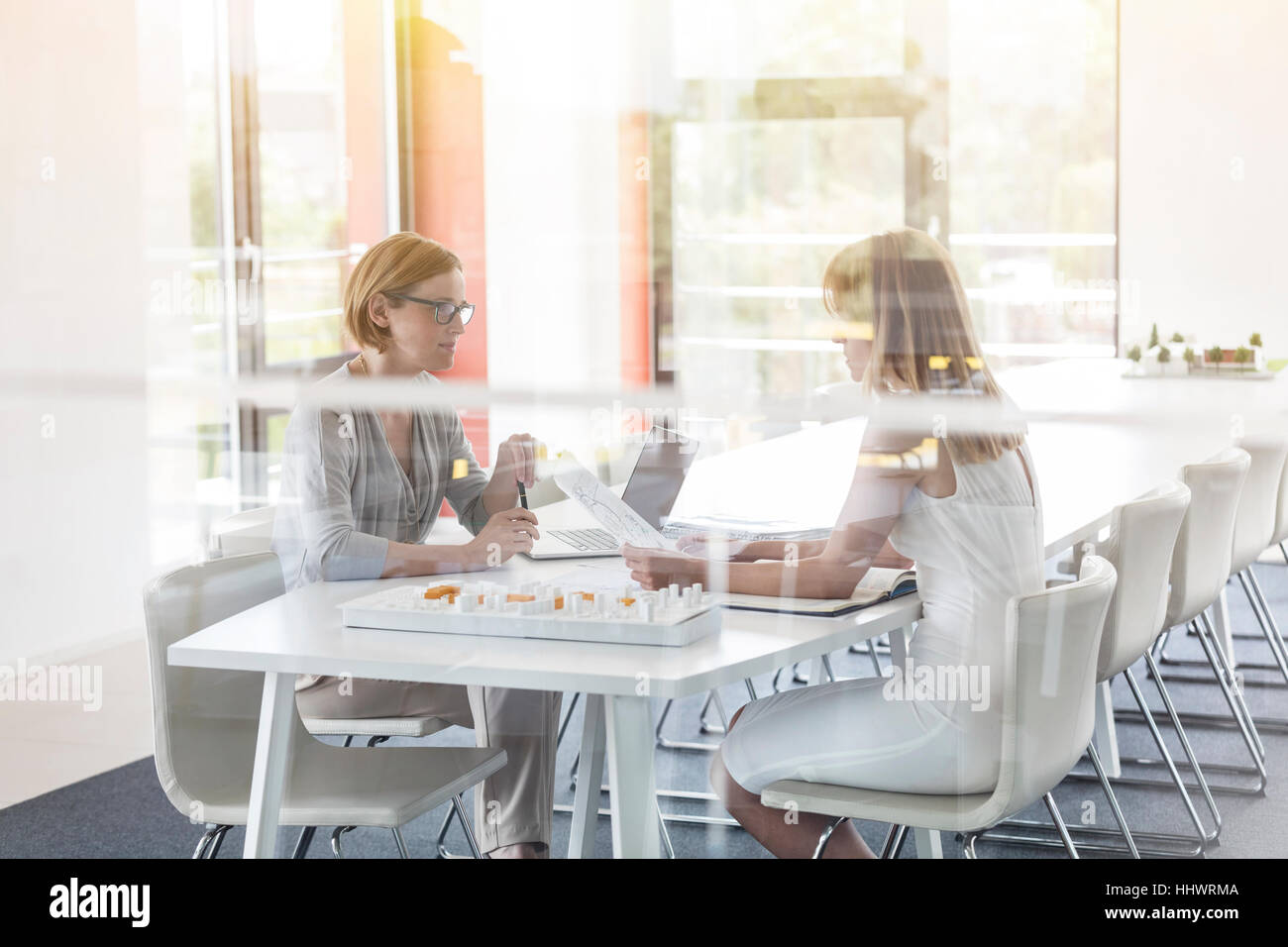 Female architects meeting in conference room Stock Photo - Alamy