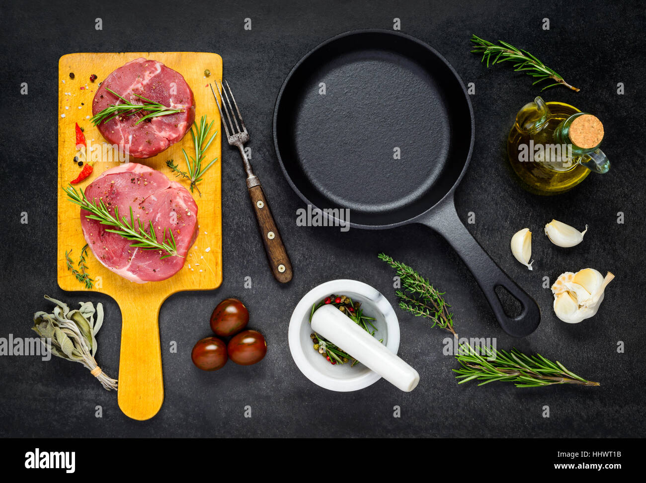Raw Meat with Black Iron Frying Pan and Cooking Ingredients on Top View ...