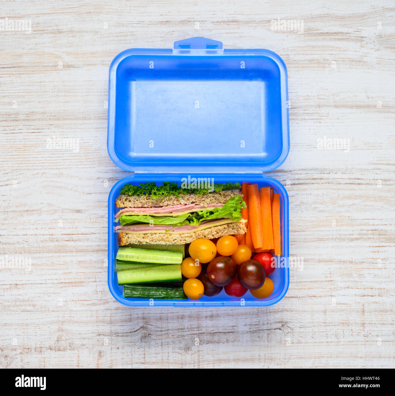 Blue Lunch Box with Sandwich and Fresh vegetables Stock Photo - Alamy
