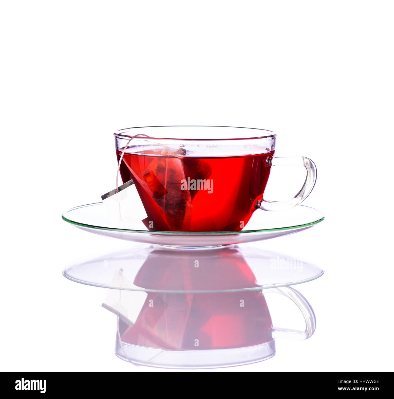 One glass of red tea in glass-cup with tea-bag isolated on white ...