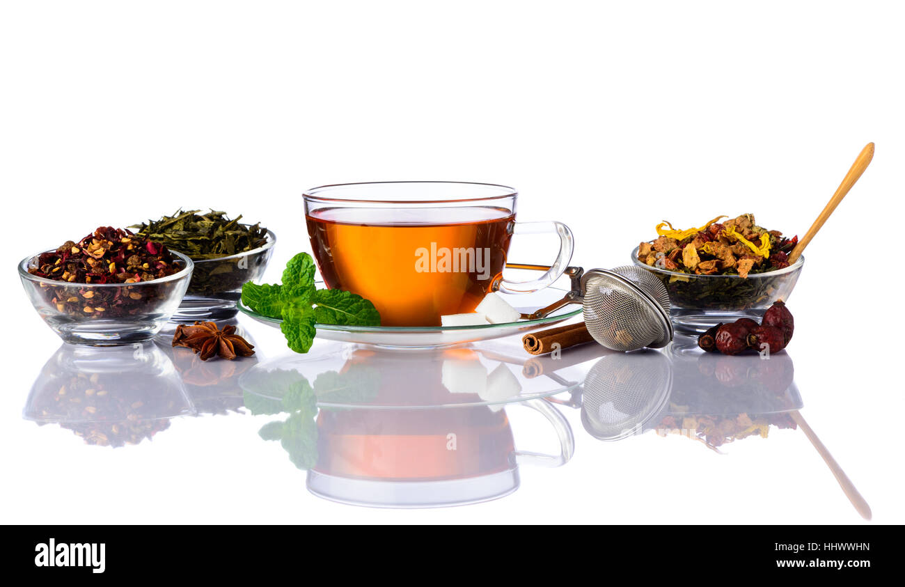 Cup of tea and different Tea ingredients isolated on white background ...