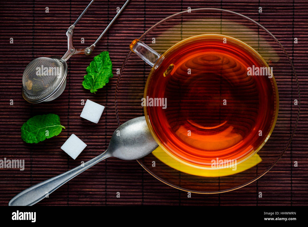 Black Tea in top view. Glass cup and tea utensil Stock Photo - Alamy