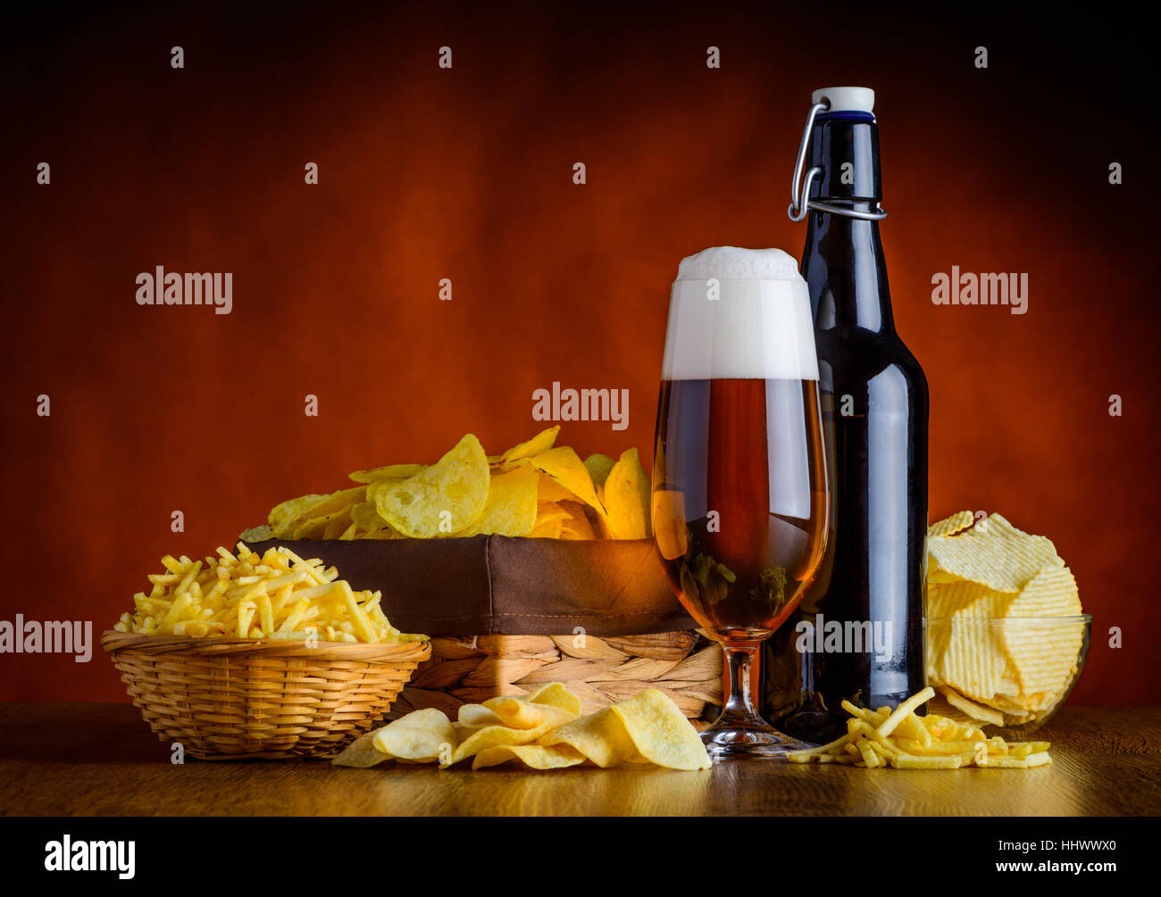 Glass and Bottle Beer with junk-food, potato-chips in still life Stock ...