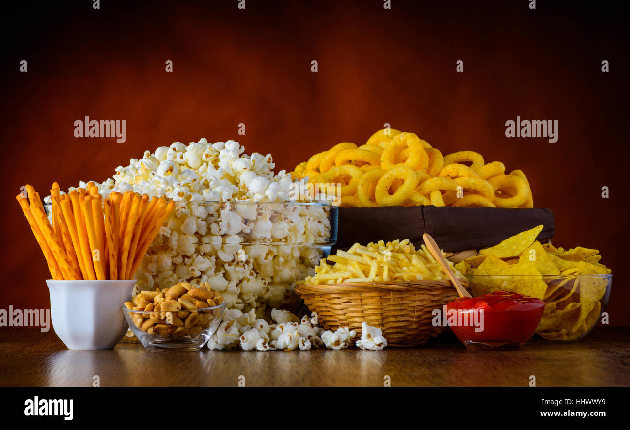 Differnt Types of Junk food, Popcorn, salty-sticks, salty-crackers on ...