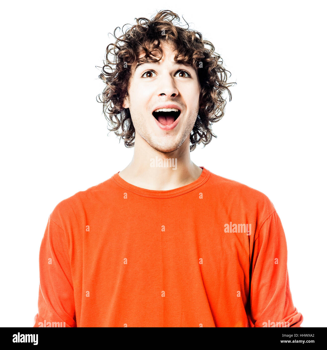 one young man caucasian happy looking up portrait in studio white ...