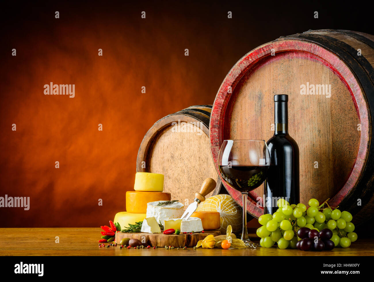 Red-wine with cheese and barrel in still lif Stock Photo - Alamy