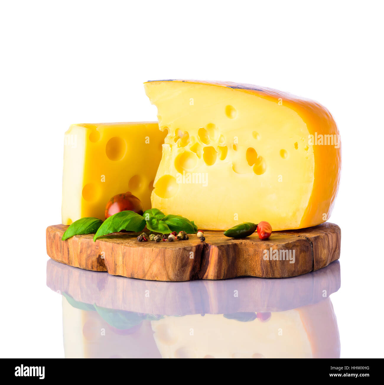 Yellow swiss emmental cheese on white background Stock Photo - Alamy
