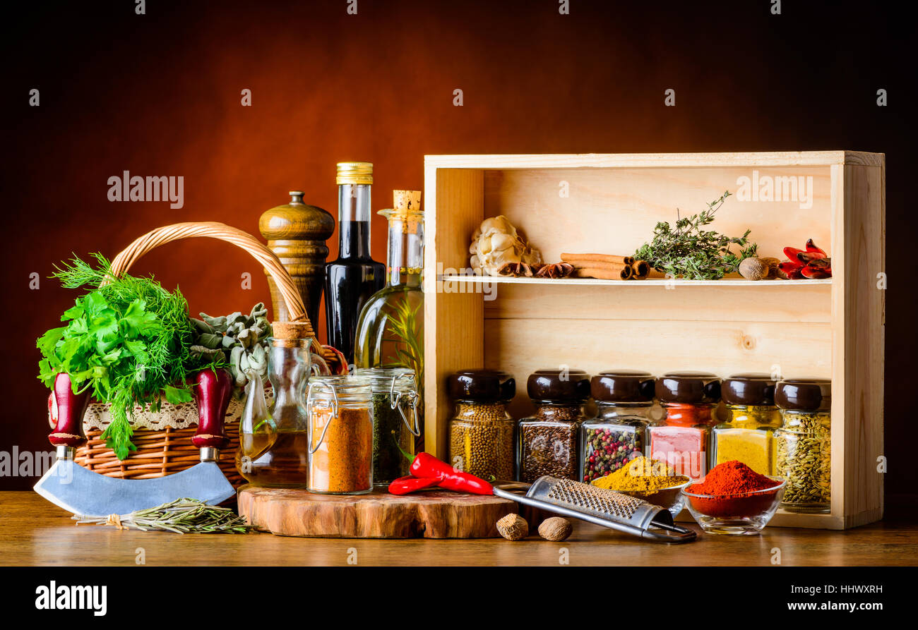 Basket with fresh green herbs and food cooking ingredients and spices ...